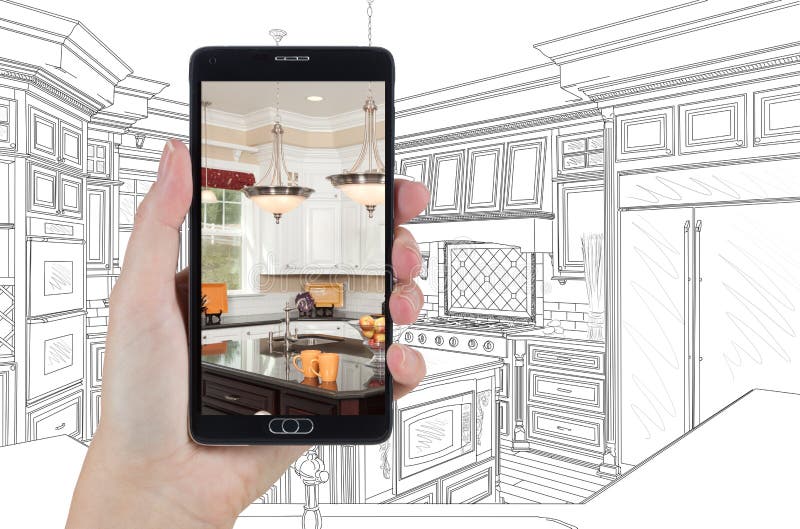 Hand Holding Smart Phone Displaying Photo of Kitchen Drawing Behind ...