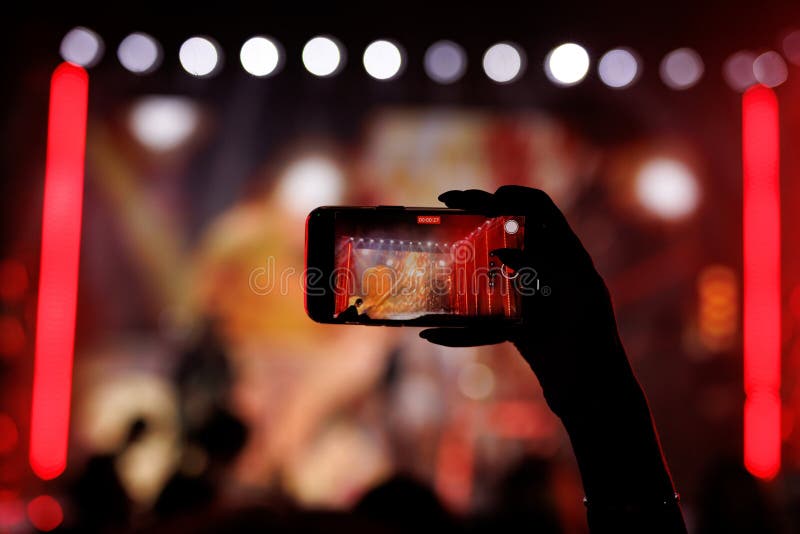 Hand Holding a Smartphone for Filming a Concert Stock Image - Image of ...