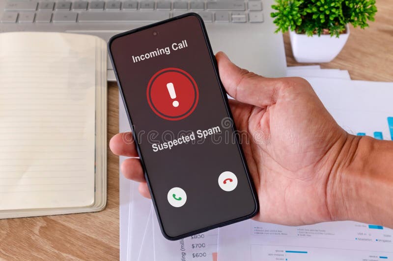 Hand Holding a Smartphone with Incoming Call from Unknown Caller on the ... Hand Holding a Smartphone with Incoming Call from Unknown Caller on the ...