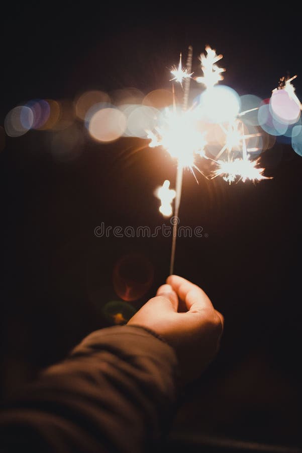 Hand Holding a Sparkler at Night. Stock Image - Image of dark, fire ...