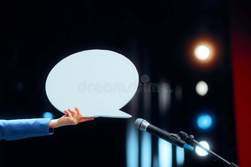 Hand Holding a Speech Bubble at the Microphone Stock Image - Image of ...