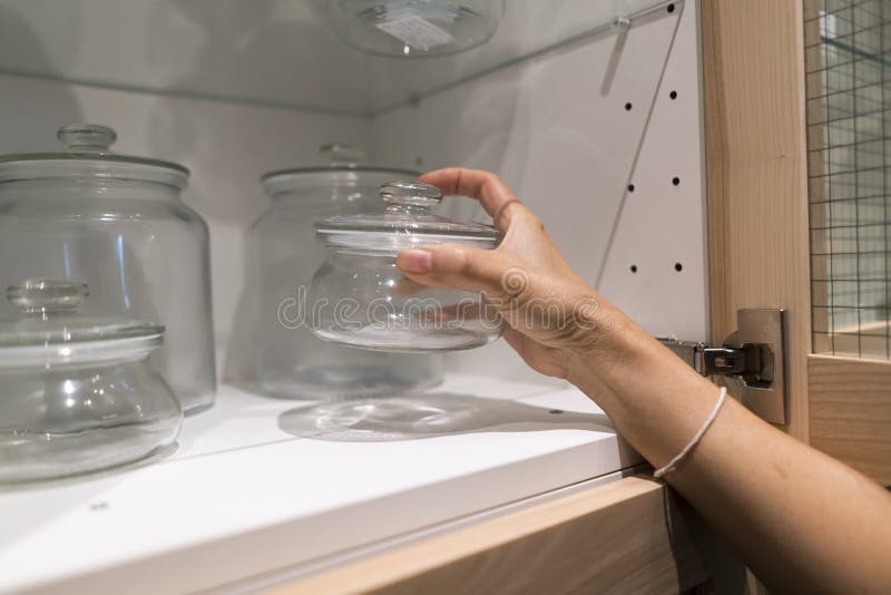 Hand Holding a Spherical Glass Jar with Lid Stock Image - Image of ...