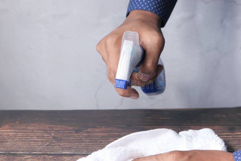Hand Holding Spray Bottle Cleaning a Table Stock Image - Image of ...