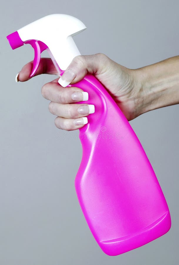 Hand Holding a Spray Bottle. Conceptual Image Shot Stock Photo - Image ...