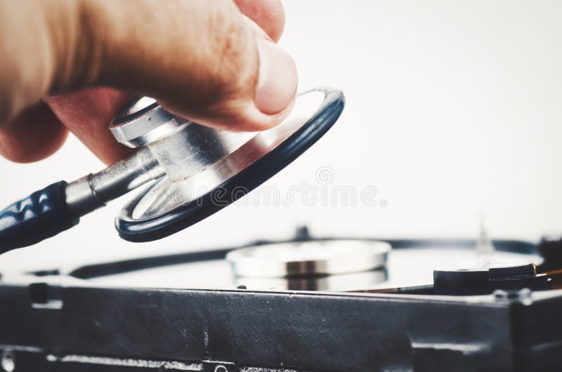 Hand Holding Stethoscope for Diagnose Old Dusty Disassembled Hard Drive ...