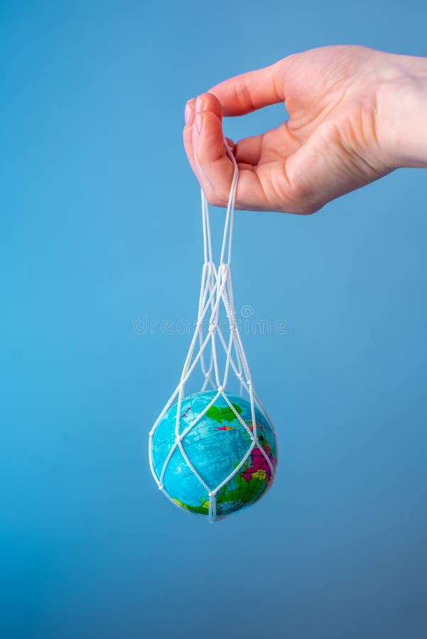 Hand Holding a String Bag with the Planet Earth. Caring for the ...