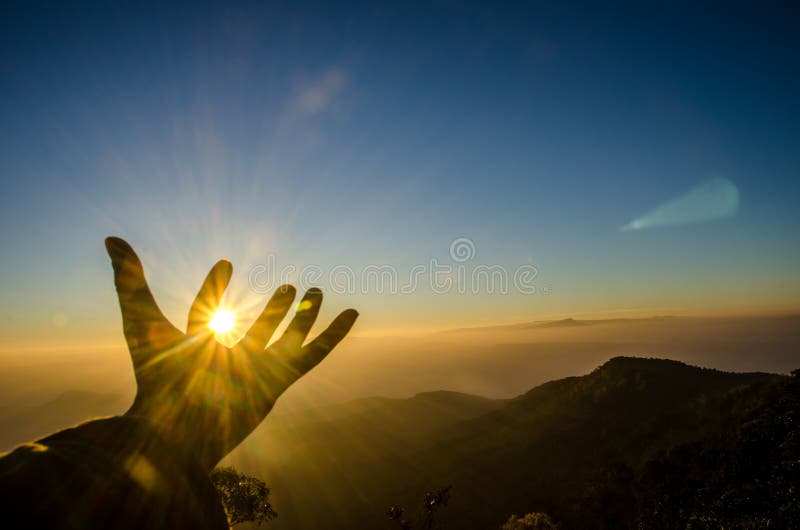 Hand Holding the Sun on Mountain Stock Photo - Image of changing ...