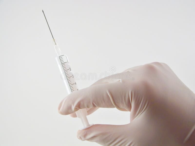 Hand holding a syringe stock photo. Image of cell, medicine - 563398