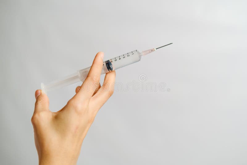 Hand Holding Syringe for Injection Stock Photo - Image of scientific ...