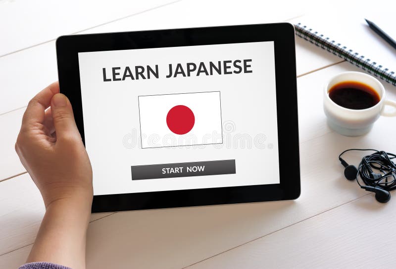 Hand Holding Tablet with Learn Japanese Concept on Screen Stock Photo ...