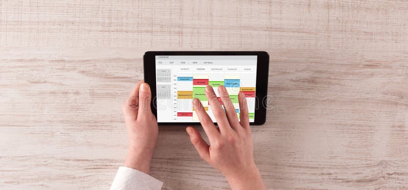 Hand Holding Tablet with Timetable Concept Stock Image - Image of ...