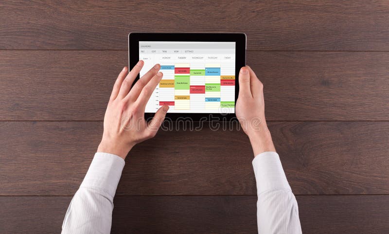 Hand Holding Tablet with Timetable Concept Stock Image - Image of ...