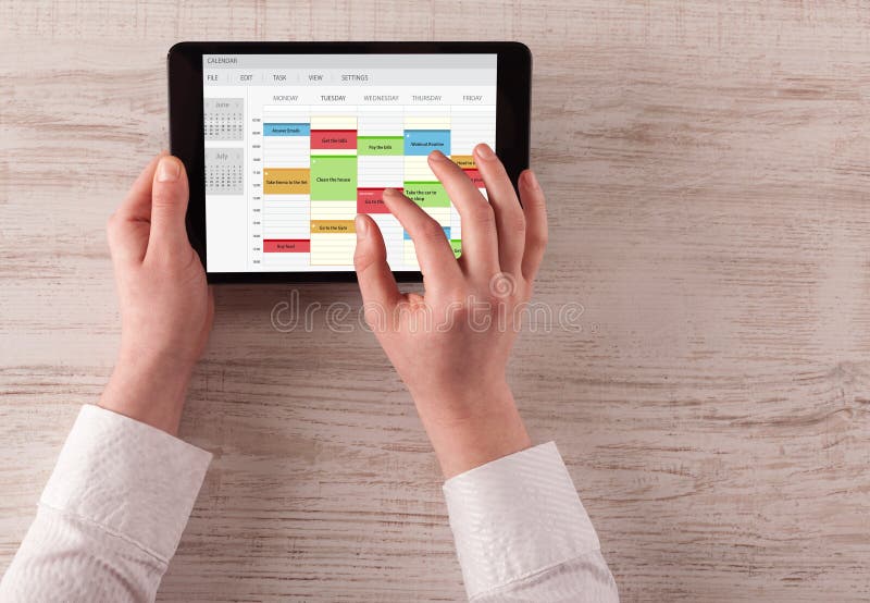 Hand Holding Tablet with Timetable Concept Stock Image - Image of ...