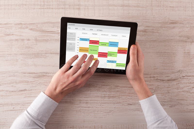 Hand Holding Tablet with Timetable Concept Stock Image - Image of file ...