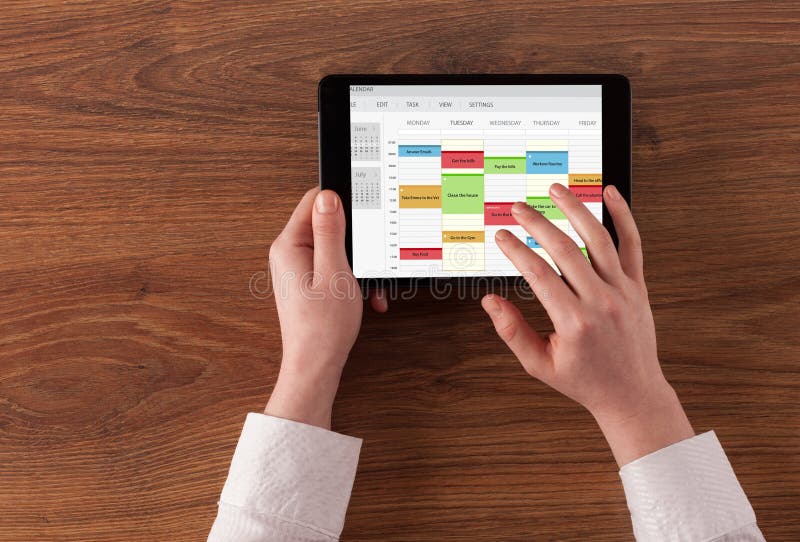 Hand Holding Tablet with Timetable Concept Stock Photo - Image of ...