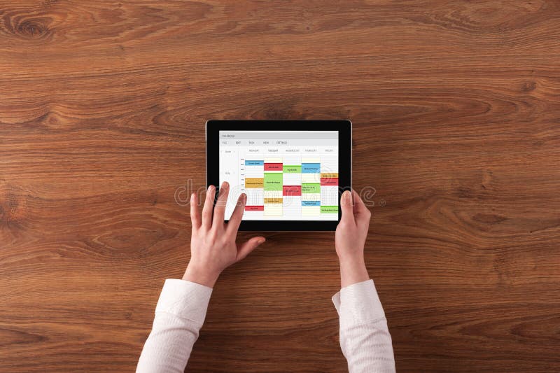 Hand Holding Tablet with Timetable Concept Stock Image - Image of ...
