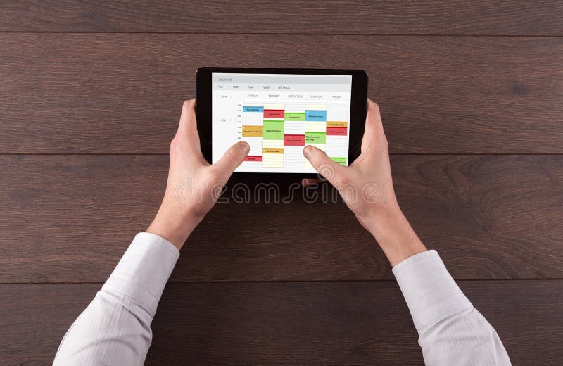 Hand Holding Tablet with Timetable Concept Stock Photo - Image of ...