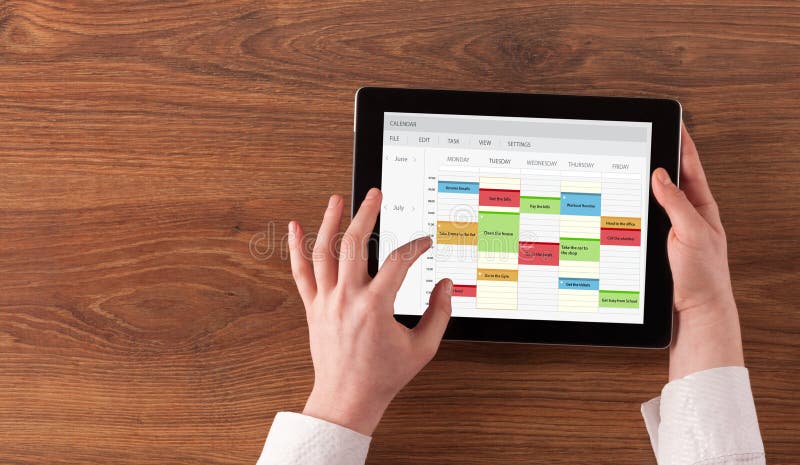 Hand Holding Tablet with Timetable Concept Stock Image - Image of ...