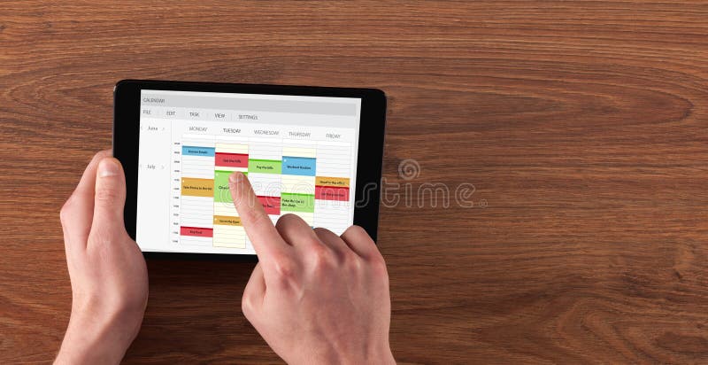 Hand Holding Tablet with Timetable Concept Stock Image - Image of ...