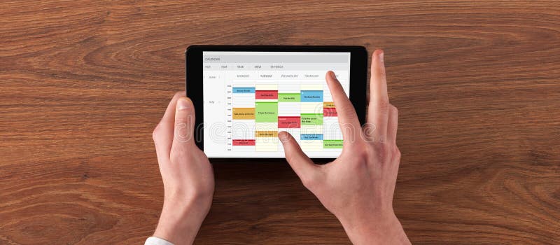 Hand Holding Tablet with Timetable Concept Stock Image - Image of ...