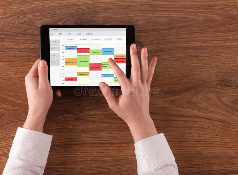 Hand Holding Tablet with Timetable Concept Stock Image - Image of ...
