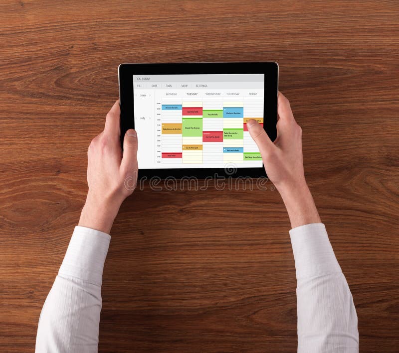 Hand Holding Tablet with Timetable Concept Stock Image - Image of ...