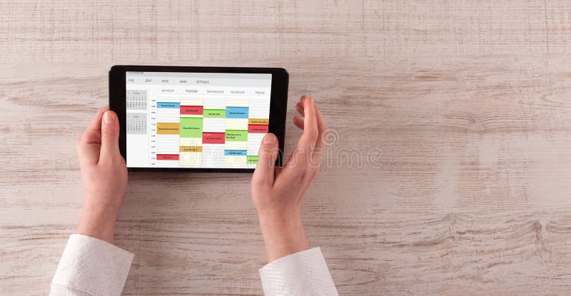 Hand Holding Tablet with Timetable Concept Stock Photo - Image of ...