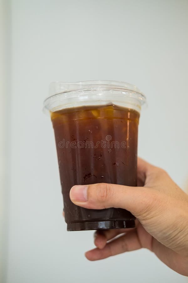 Hand Holding a Take-out Iced Black Coffee at Coffee Shop Stock Image ...