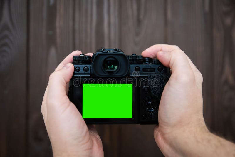 Hand Holding and Taking Shot with Green Display Mirrorless Camera on ...