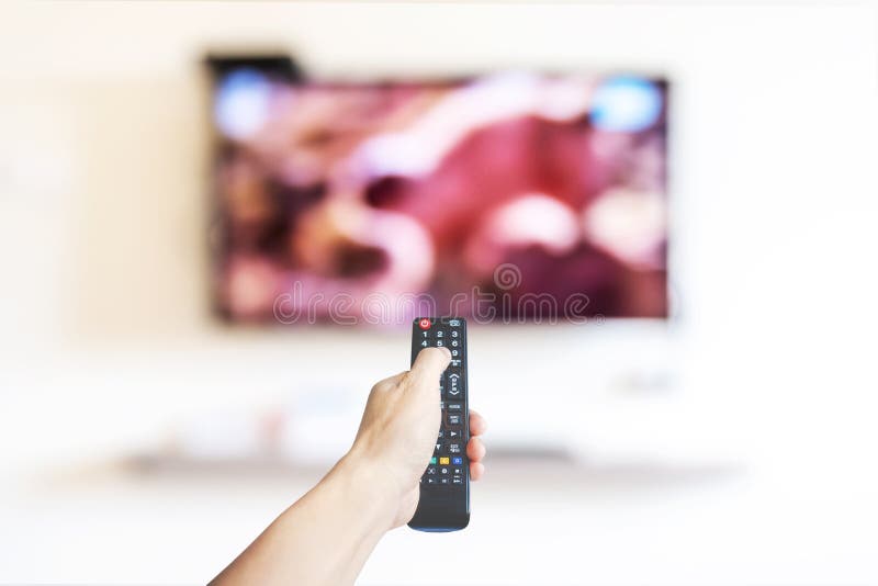 Hand Holding Television and Audio Multimedia Remote Control for ...