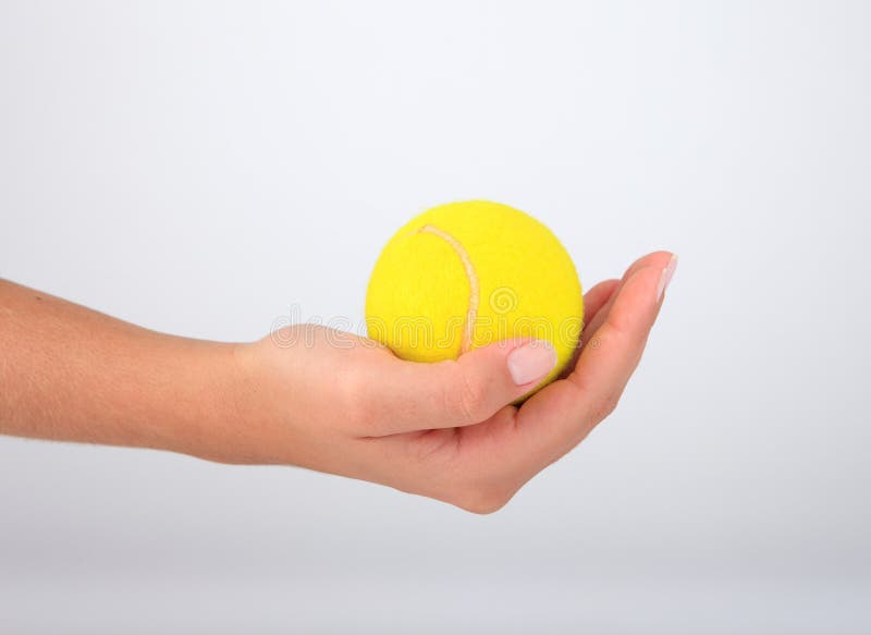 Hand holding tennis ball stock photo. Image of part, white - 10838884