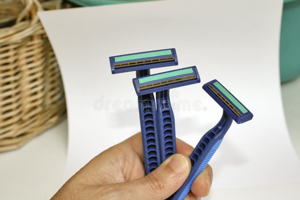 Hand Holding Three Blue Razors Stock Photo - Image of handle, manual ...