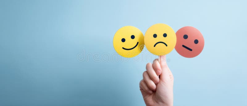 The Hand Holding Three Emoticons Representing Various Emotional States ...