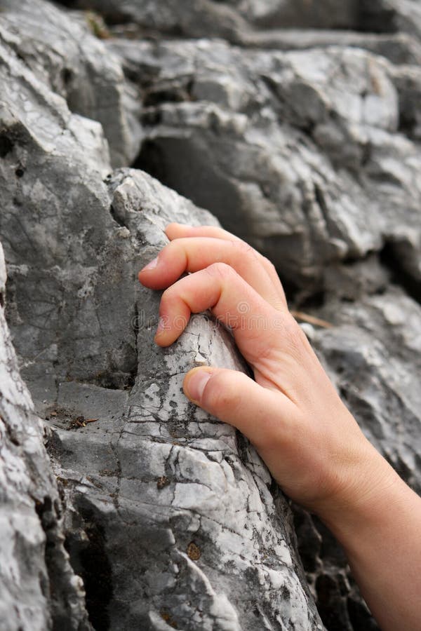 Hand Holding Tight on a Rock Stock Photo - Image of holding, white: 9032284
