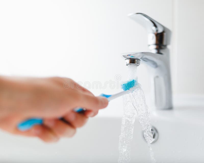 Toothbrush Under Running Water Stock Photo - Image of equipment ...