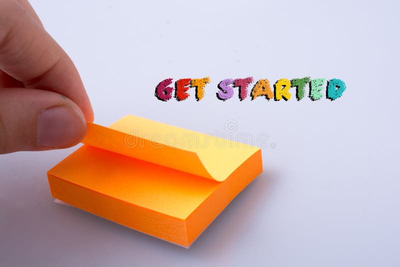 Get Started Wording Written on Blank Sign Board in Hand Stock Photo ...