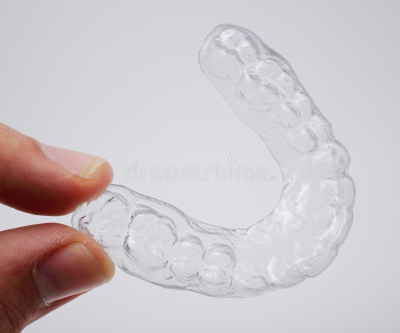 Essix Retainer Surrounded by Orthodontic Appliances and Study Models ...