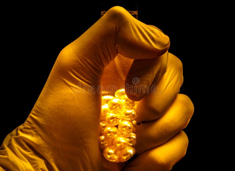 Pearls in tube stock image. Image of glove, biology, holding - 30018859
