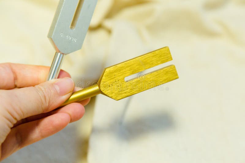 Hand Holding a Tuning Fork . Stock Photo - Image of orthopedic ...