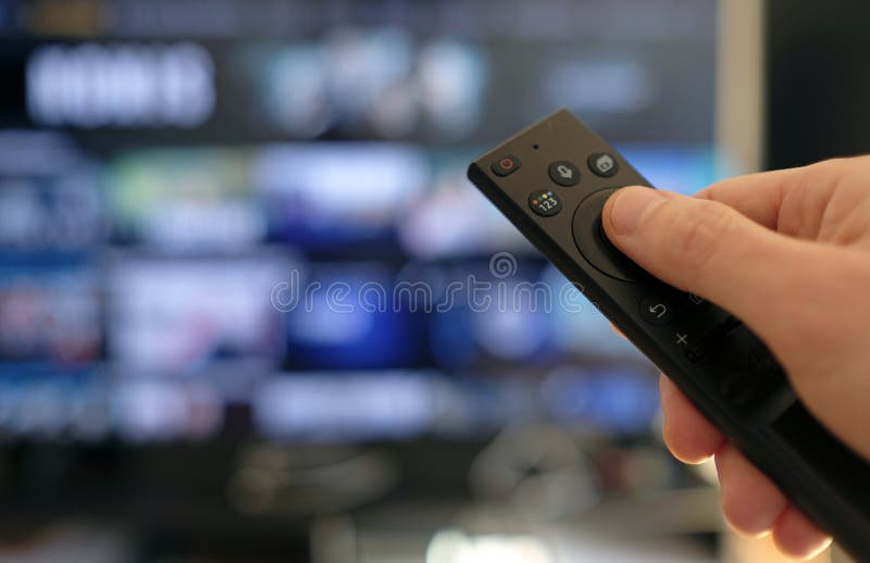Hand Holding a TV Remote Control Stock Image - Image of watching, hand ...