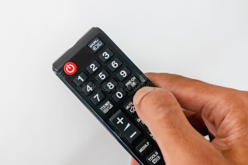 Hand Holding a Tv Remote with Many Buttons on White Background Stock ...