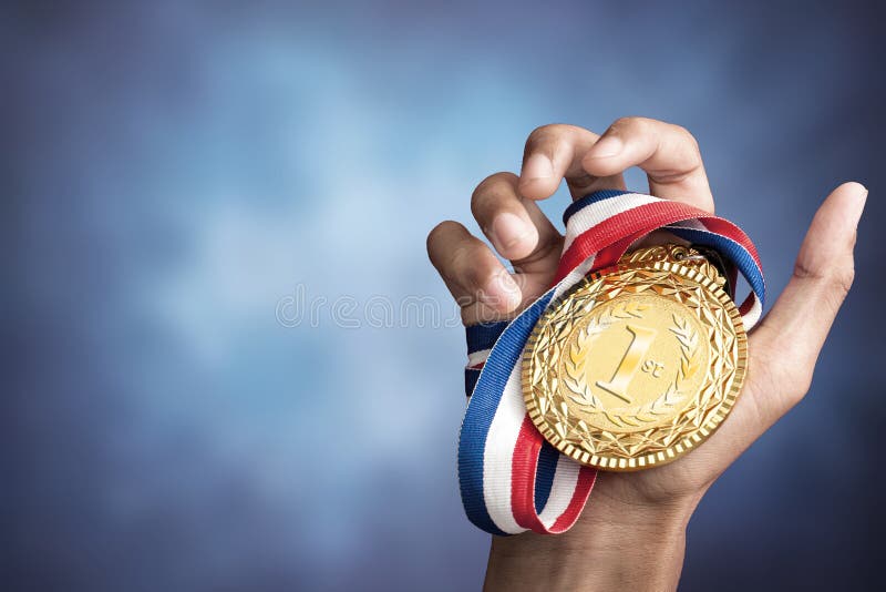190 Hand Holding Up Gold Medal Stock Photos - Free & Royalty-Free Stock ...