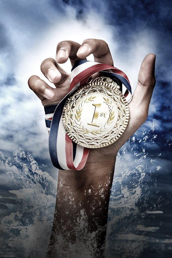Hand Holding Up a Gold Medal Stock Photo - Image of holding, award ...