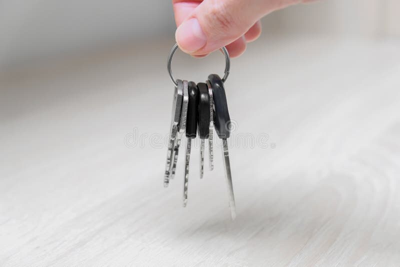 Hand Holding Up a Keys at Home, Leaving Home and Taking Keys from Table ...