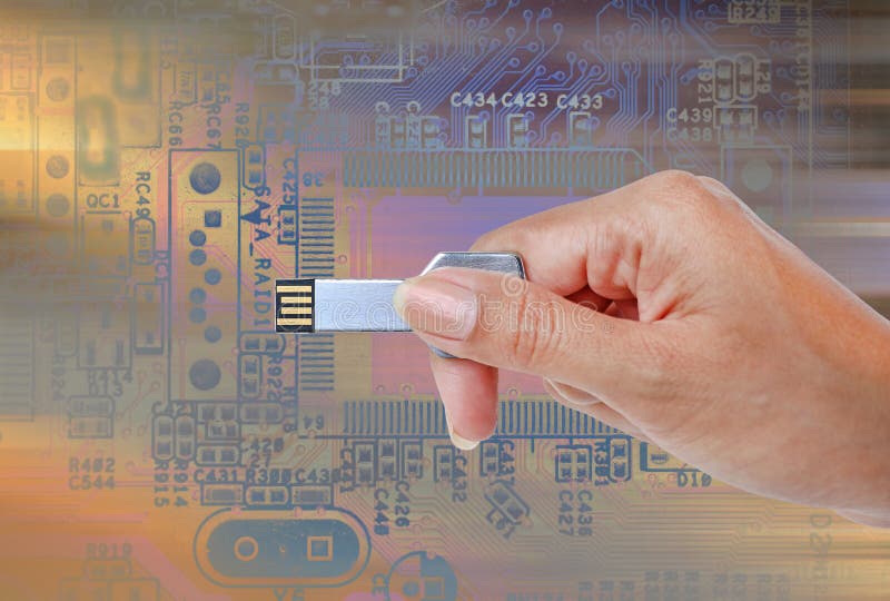 Hand Holding USB Data Storage Against Bright Light and Circuit Stock ...