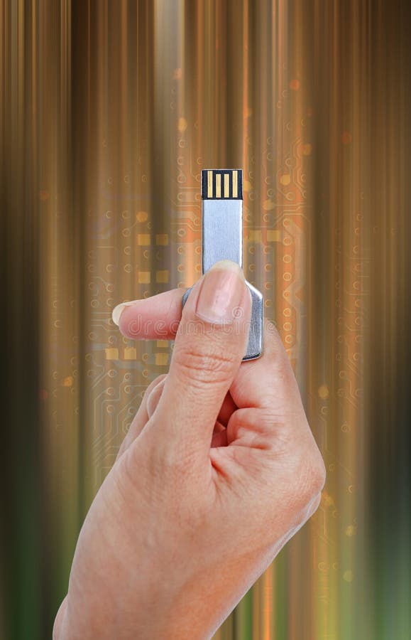 Hand Holding USB Data Storage Against Light and Circuit Stock Photo ...