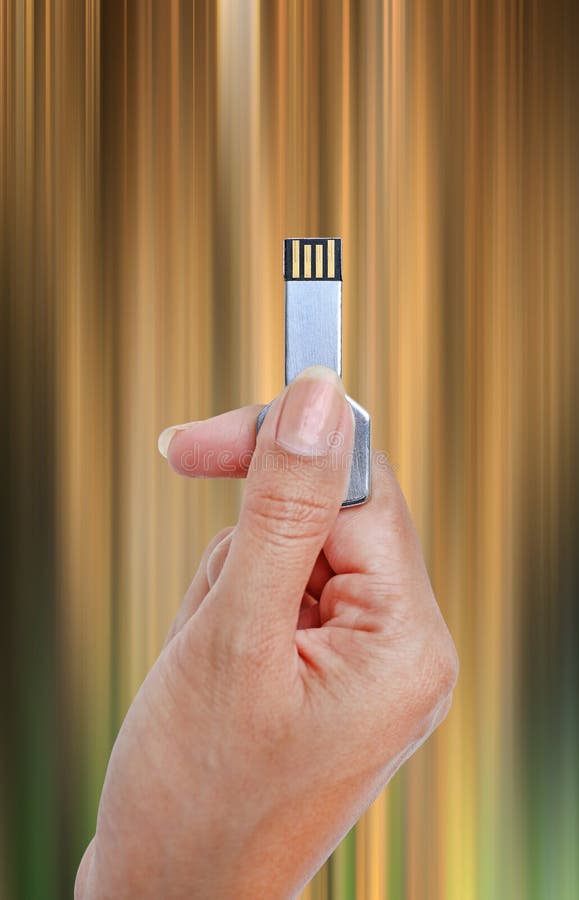 Hand Holding USB Data Storage Against Light and Circuit Stock Photo ...