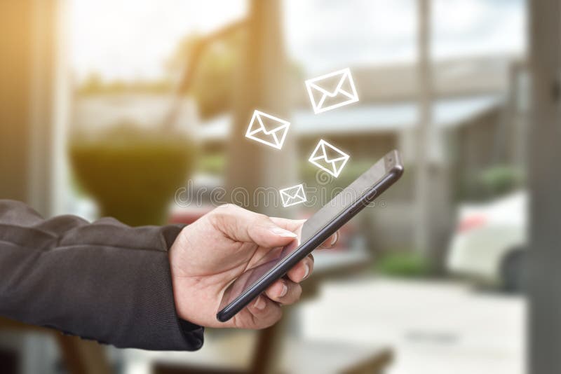 Hand Holding Using Mobile Phone with Email Icon on Screen. Stock Photo ...