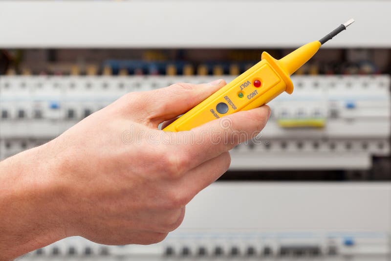 Hand holding voltmeter stock photo. Image of control - 38416980