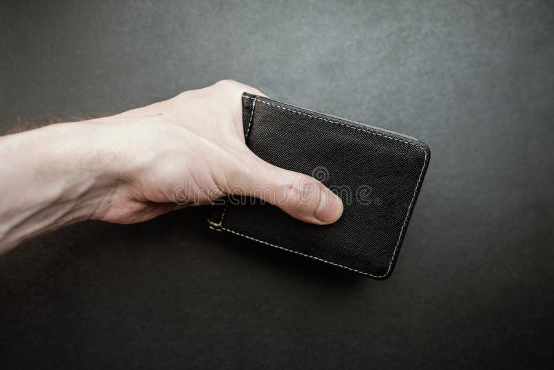 Hand holding a wallet. stock photo. Image of heap, business - 131117830